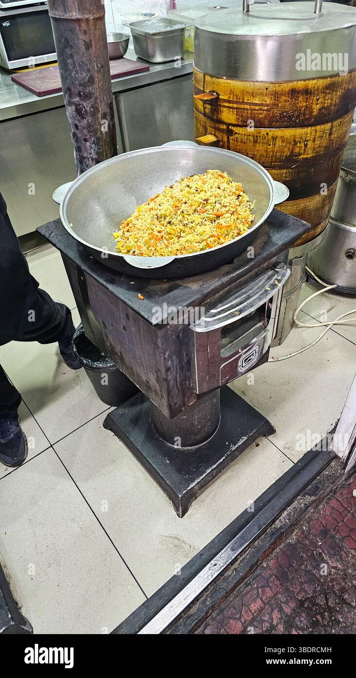 Bishkek, Kyrgyzstan - 10.05.2024: Hearty Asian Pilaf Simmering in a ...