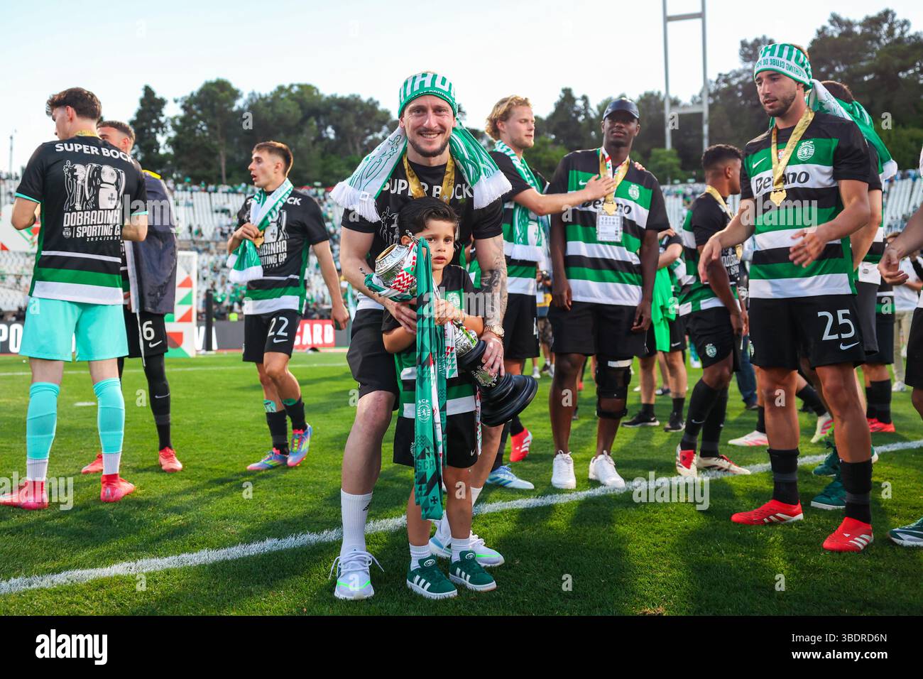 Nuno Simoes of Sporting CP celebrates with the trophy at the end of the ...
