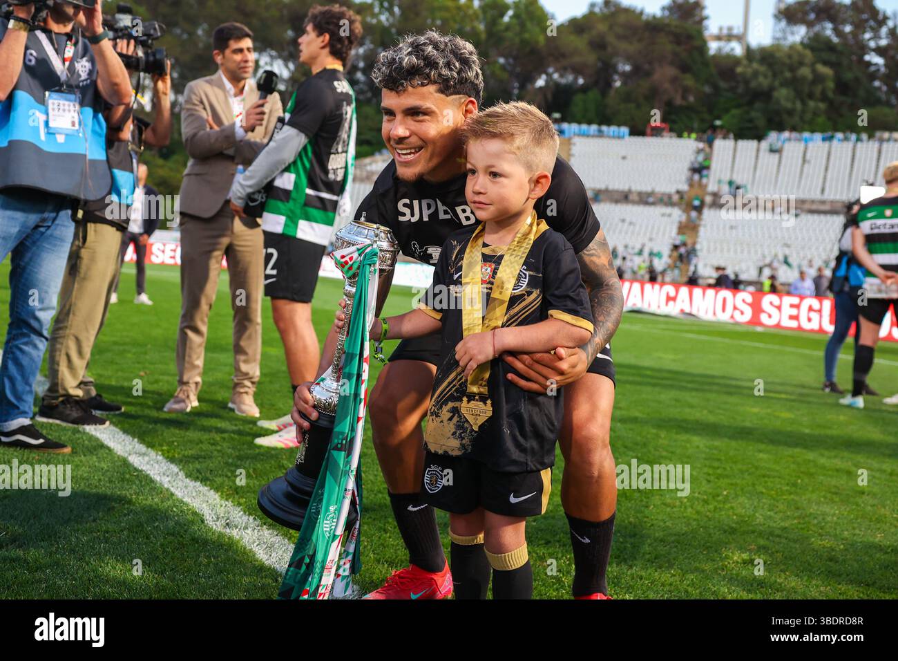 Maximiliano Araújo forward of Sporting CP celebrates with the trophy at ...