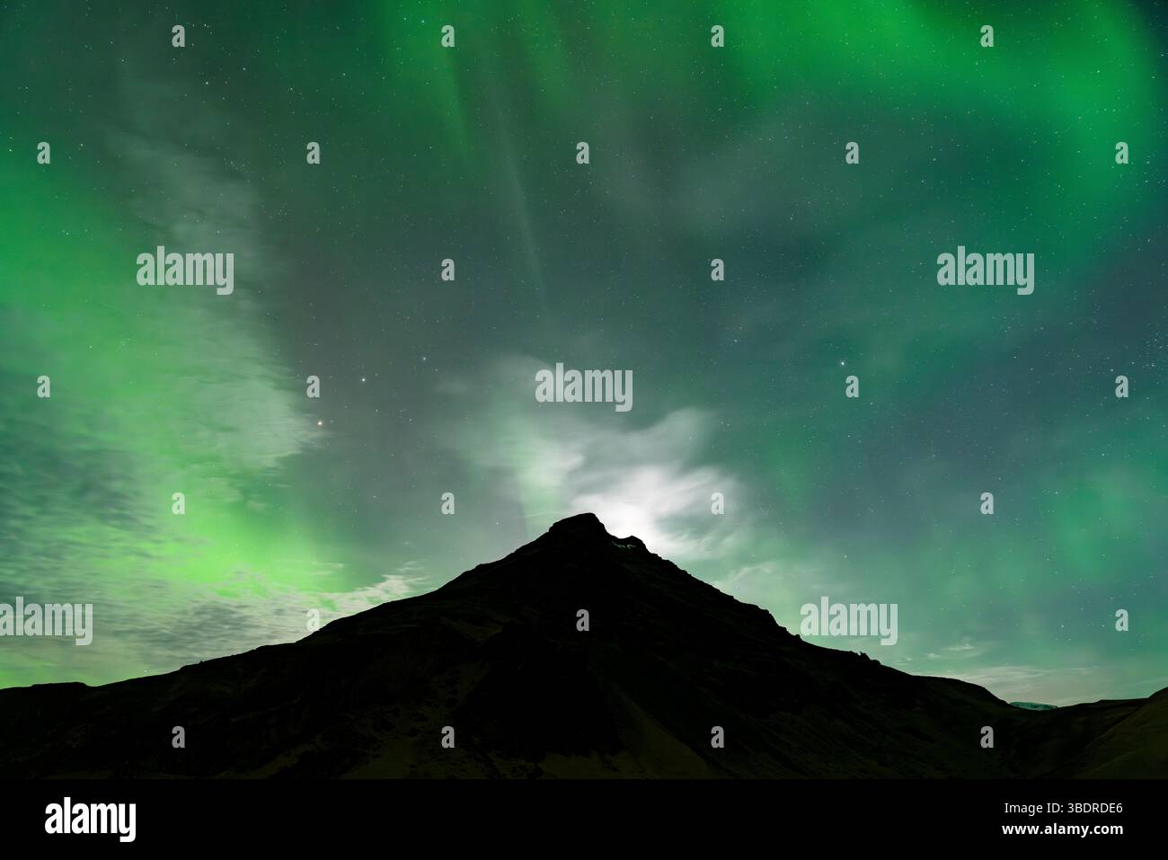 Green Northern Lights over Icelandic Mountains at Night with Starry Sky ...