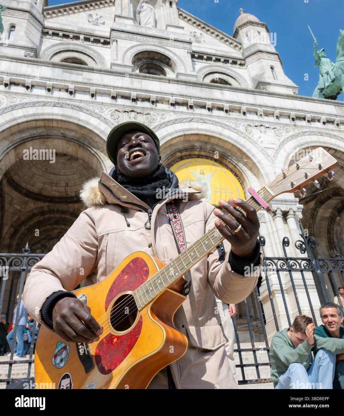 Joyful Street Musician at Sacré-Cœur. A talented busker plays his ...
