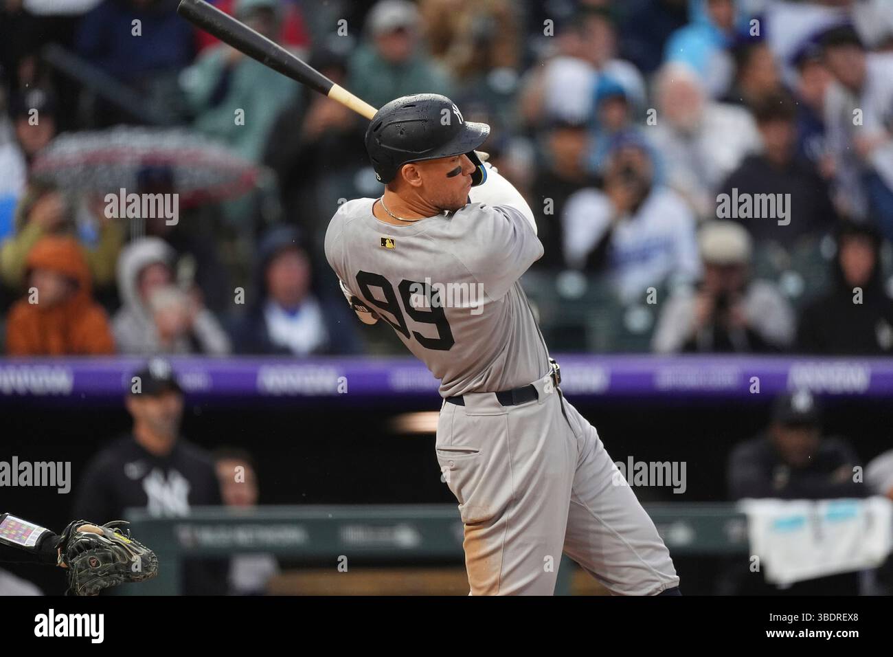 New York Yankees' Aaron Judge follows the flight of his RBI double off Colorado Rockies relief ...