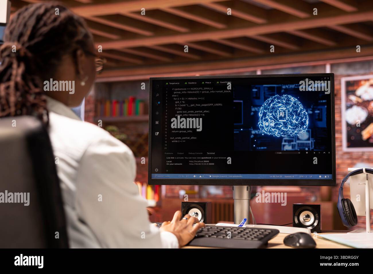 Teleworking system administrator using computer for artificial intelligence computing through ...