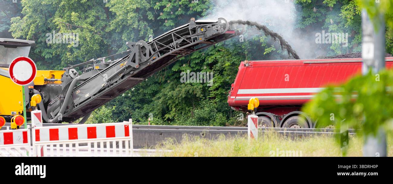 Asphalt milling and grinding machine at road repair and construction ...
