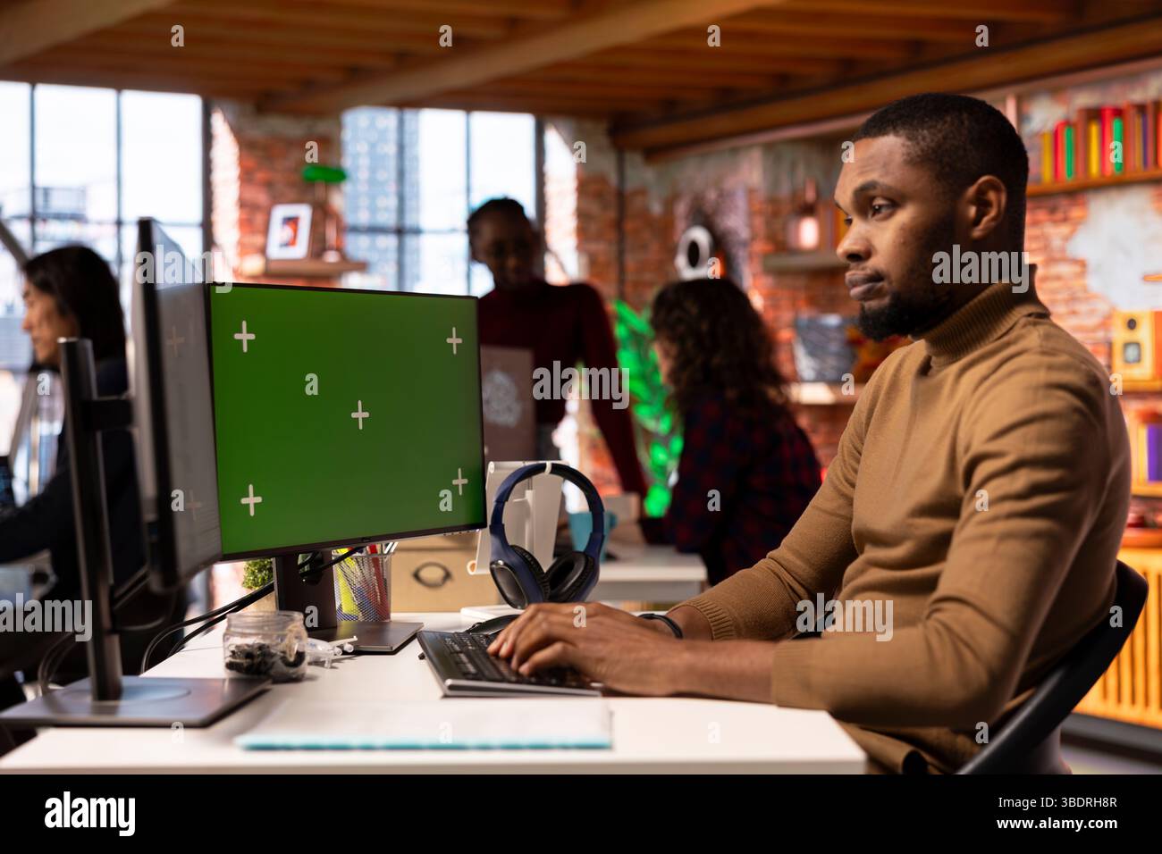 Startup entrepreneur using green screen PC to do research, looking to grow value of company ...