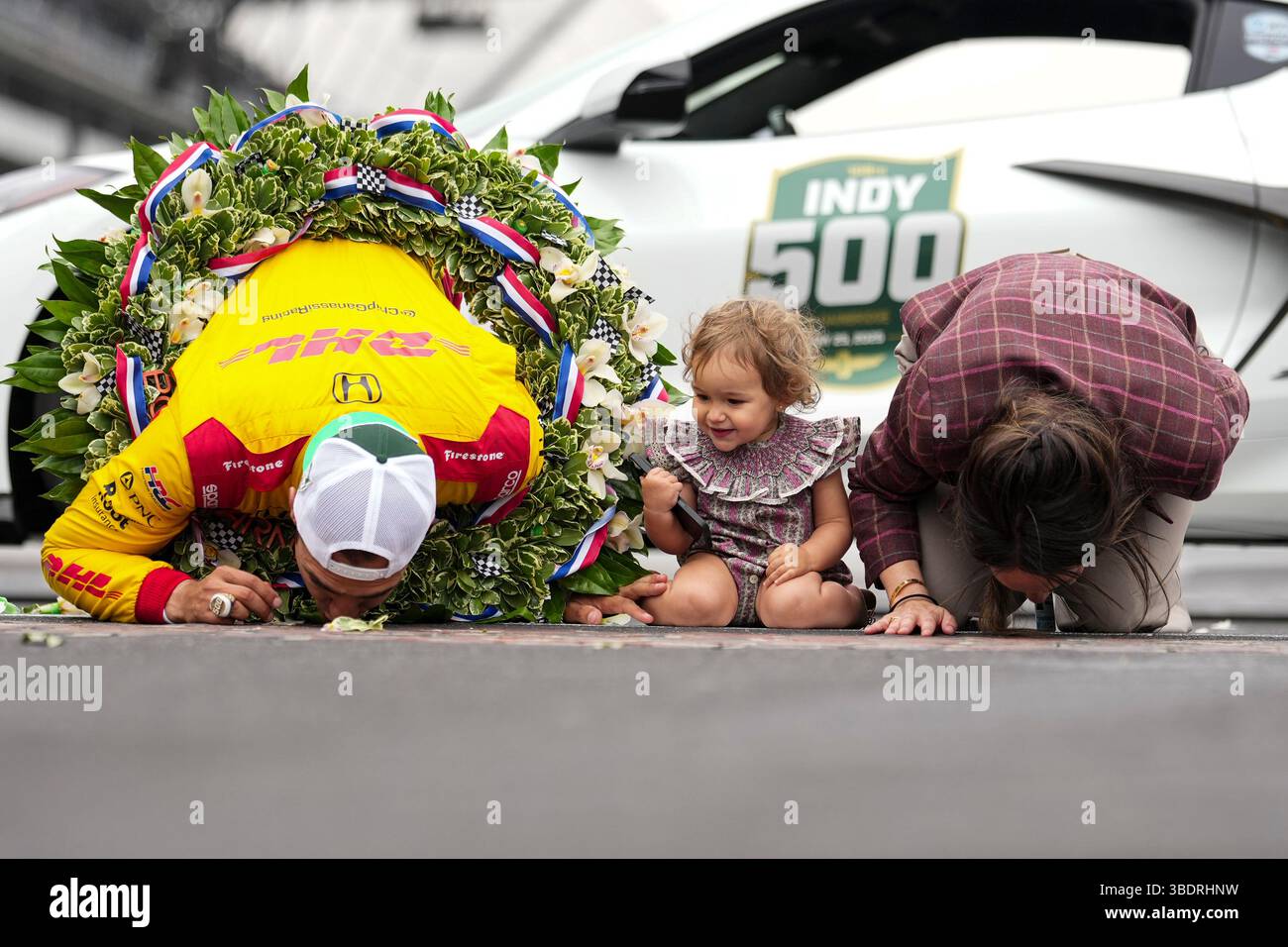 Alex Palou, of Spain, is joined by his wife Esther Valle, right, and ...