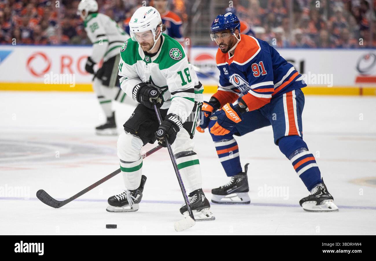 Dallas Stars' Sam Steel (18) is chased by Edmonton Oilers' Evander Kane ...