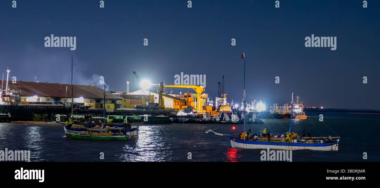 At night, the port of Mahajanga transforms into a magical scene. Soft ...