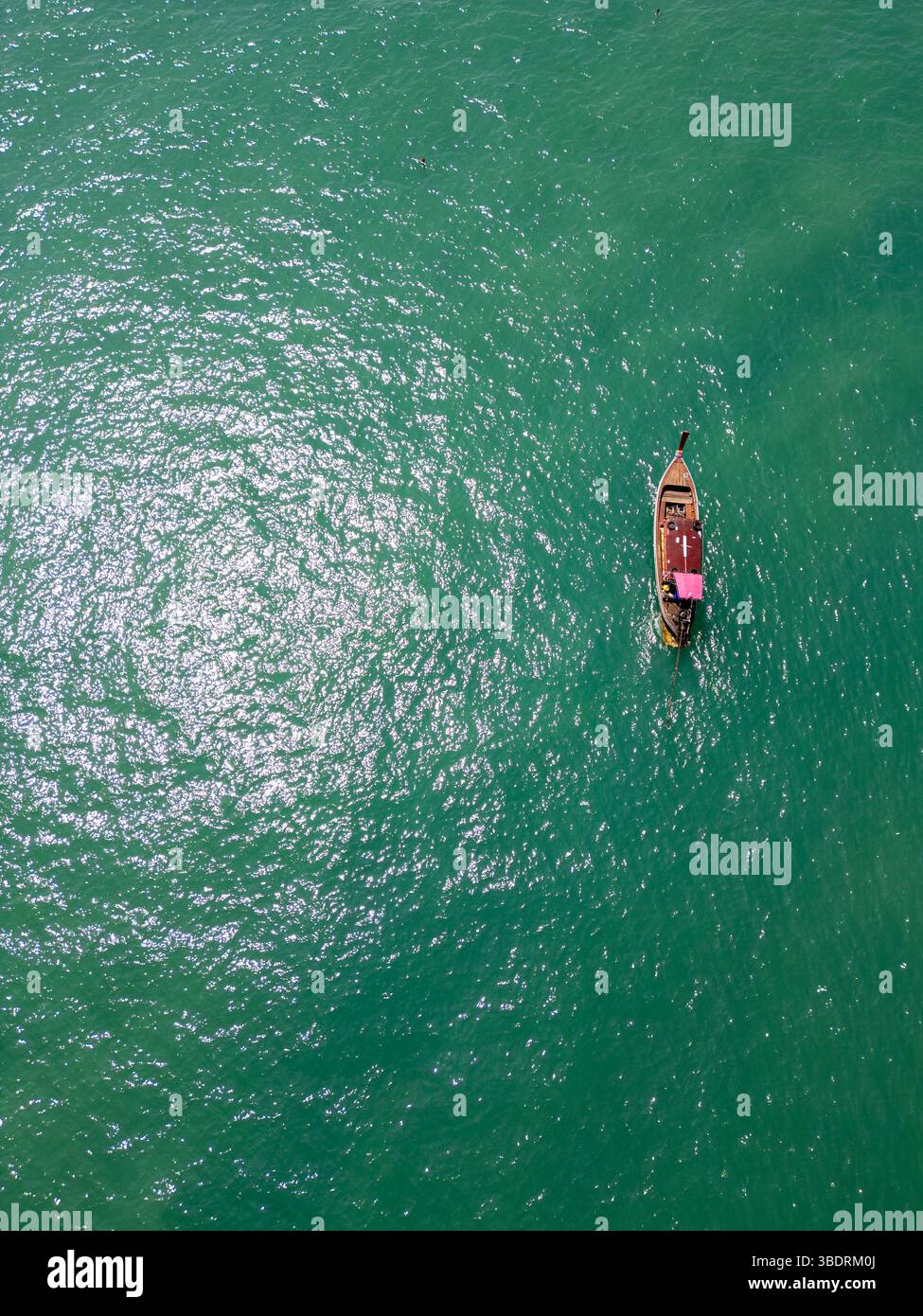 Aerial view of a sailboat cruising along Thailand exotic coastline ...