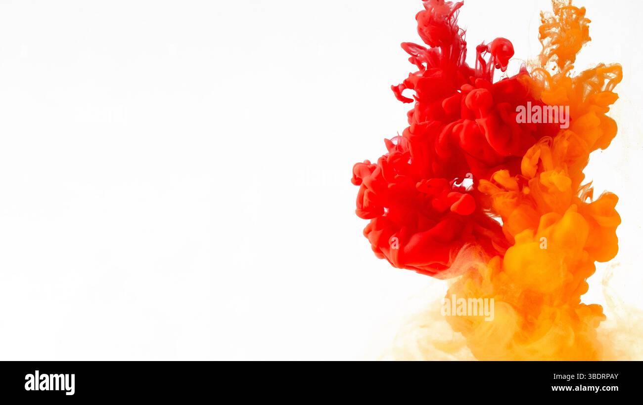 Colored ink in water creating abstract shape, isolated on white ...