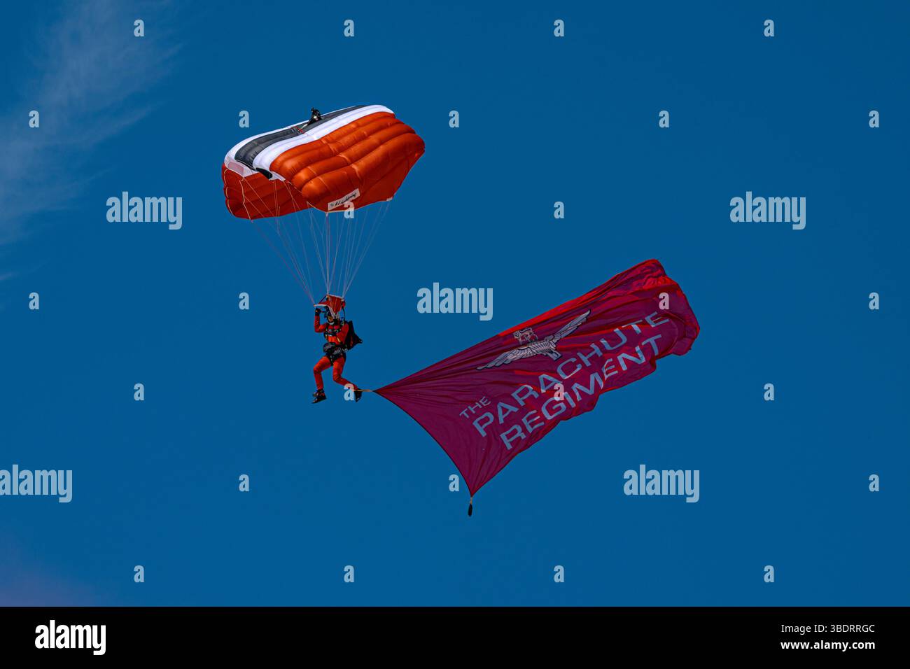 Member of the British Army Red Devils flies a flag onto Miami Beach on ...