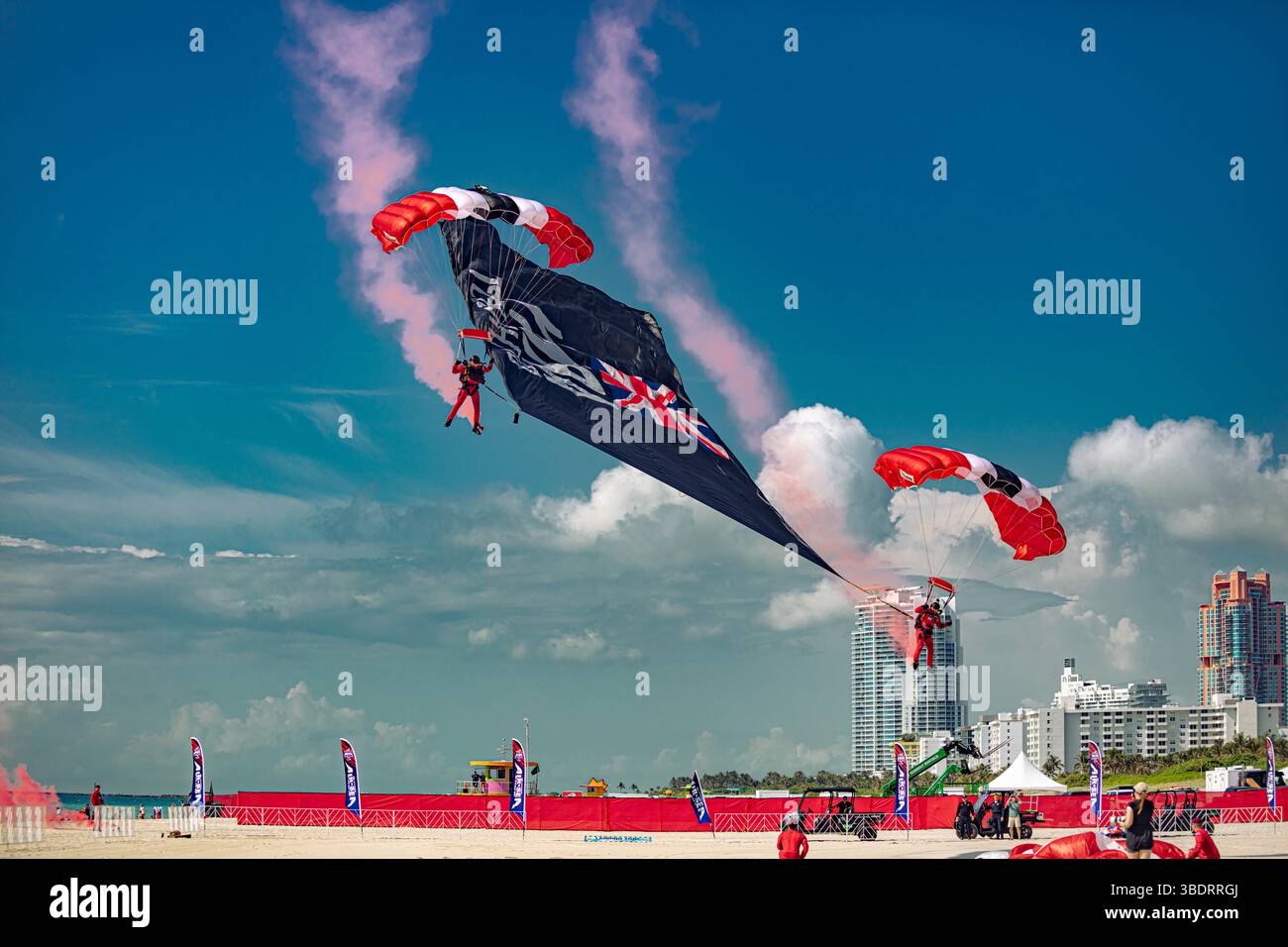 Members of the British Army Red Devils fly a drop flag onto Miami Beach ...