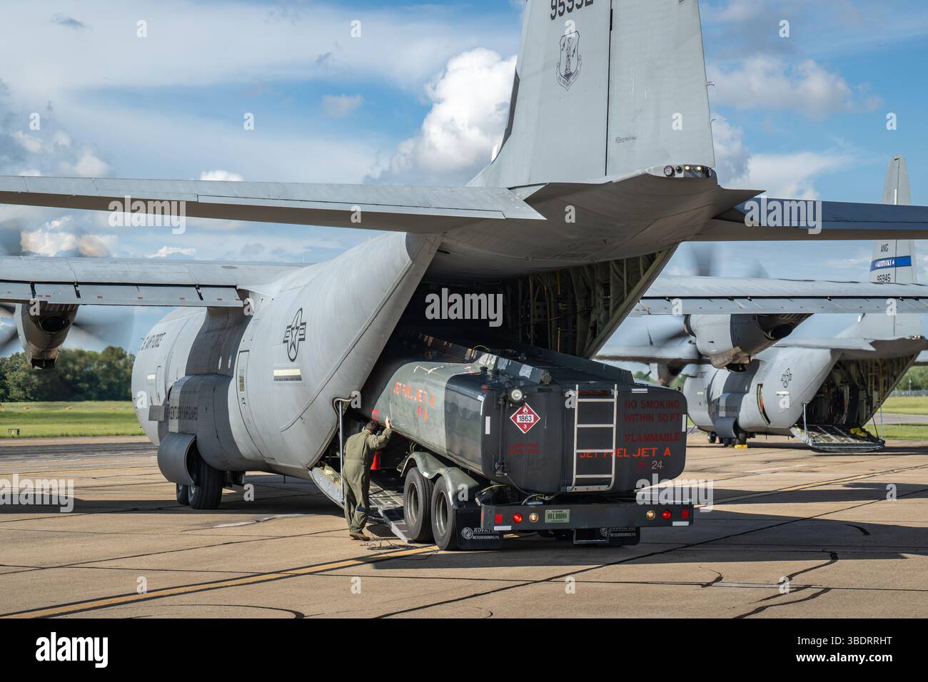 A loadmaster from the Kentucky Air National Guard’s 165th Airlift Squadron, directs the ...