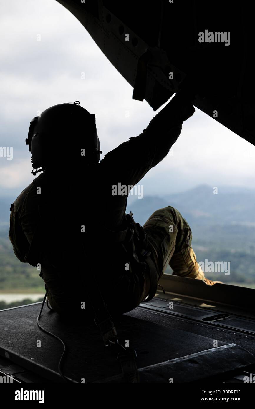 A U.S. Army soldier observes from a CH-47 Chinook at Mariscal Zavala ...