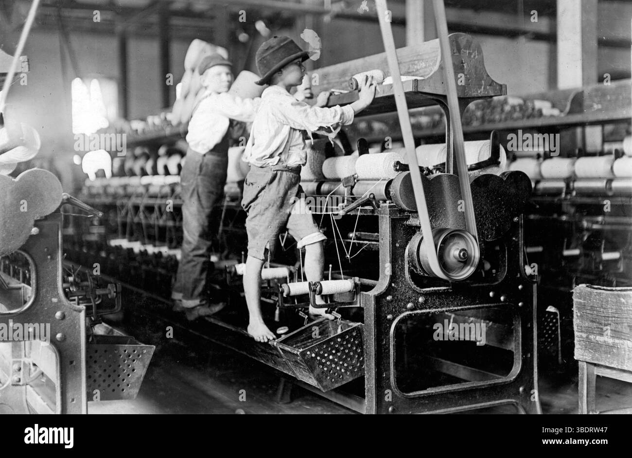 Child labourers in a cotton factory mill. Spinners & doffers in cotton ...
