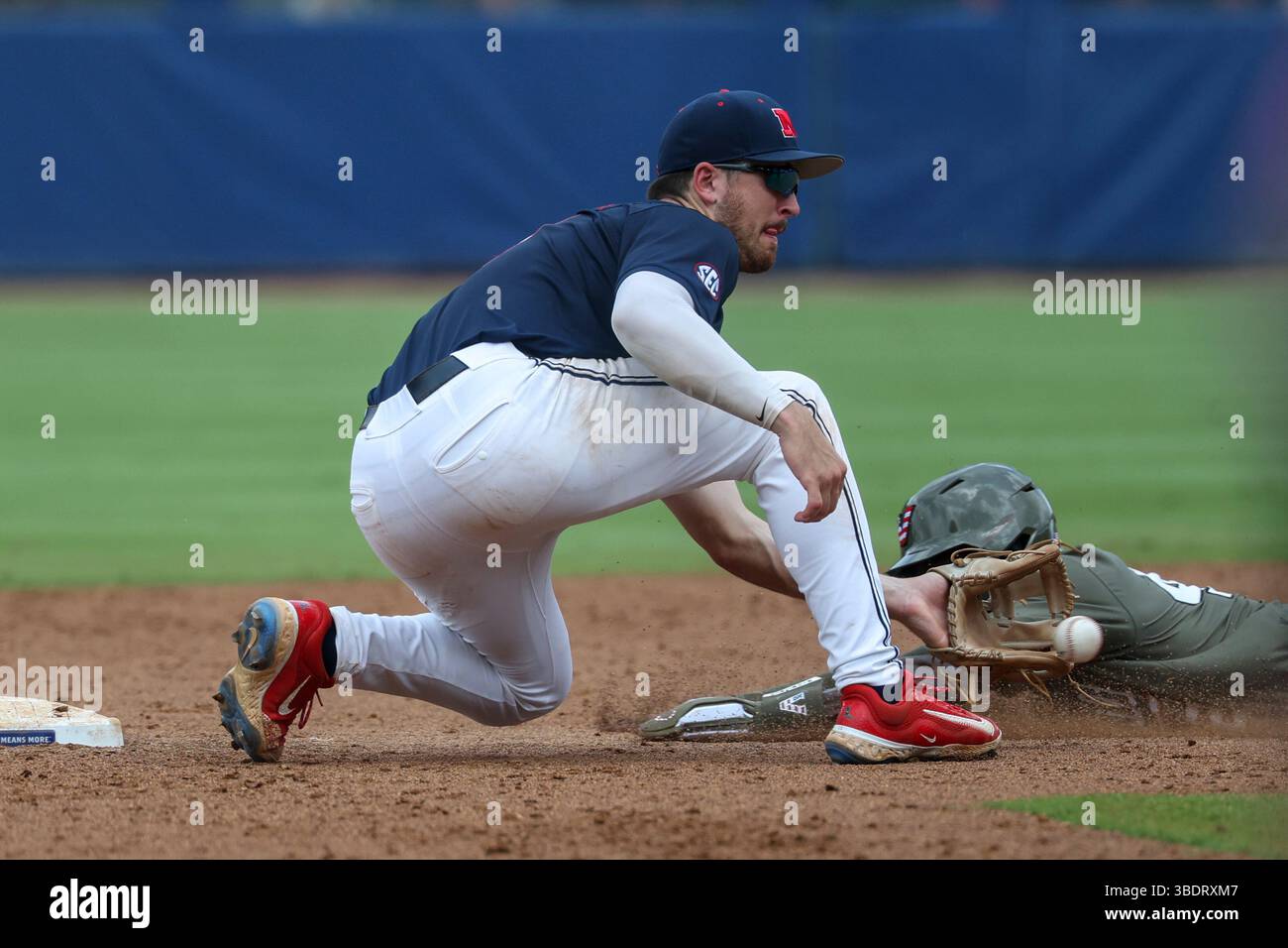HOOVER, AL - MAY 25: Ole Miss infielder Judd Utermark (27) catches the ...