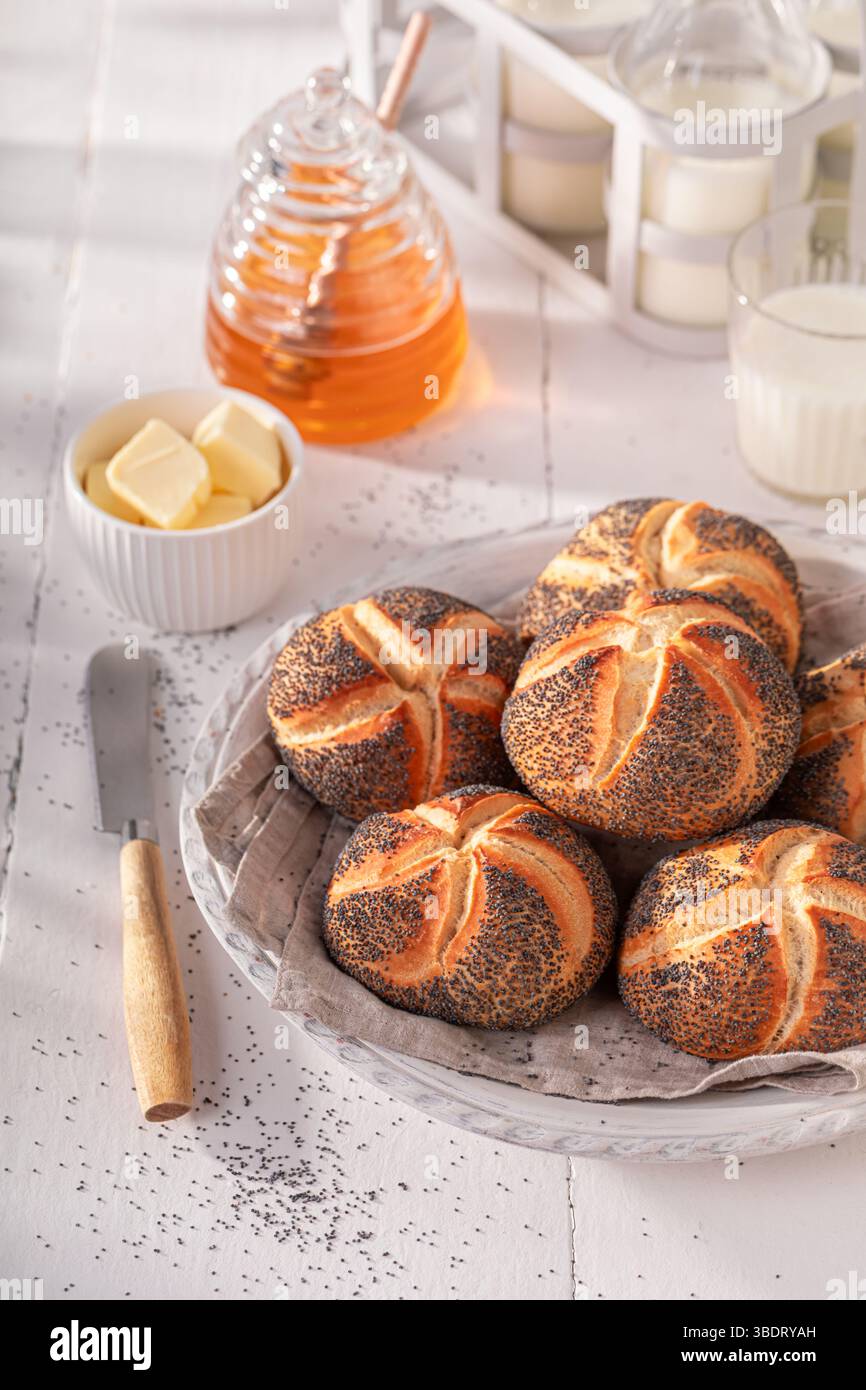 Tasty Kaiser rolls with poppy seed baked for golden brown. Breakfast ...