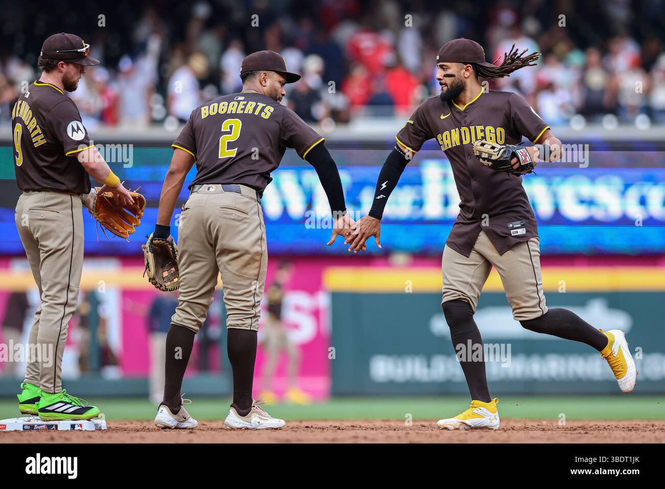San Diego Padres shortstop Xander Bogaerts (2) low-fives outfielder ...