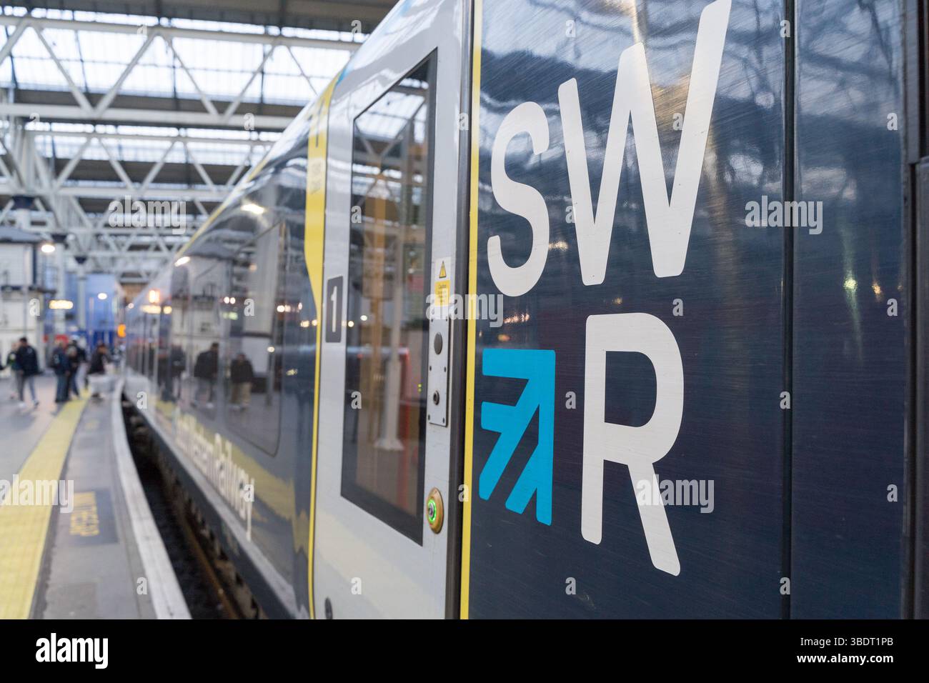 London Waterloo Terminal, UK – 25th May 2025: Passengers Board and ...