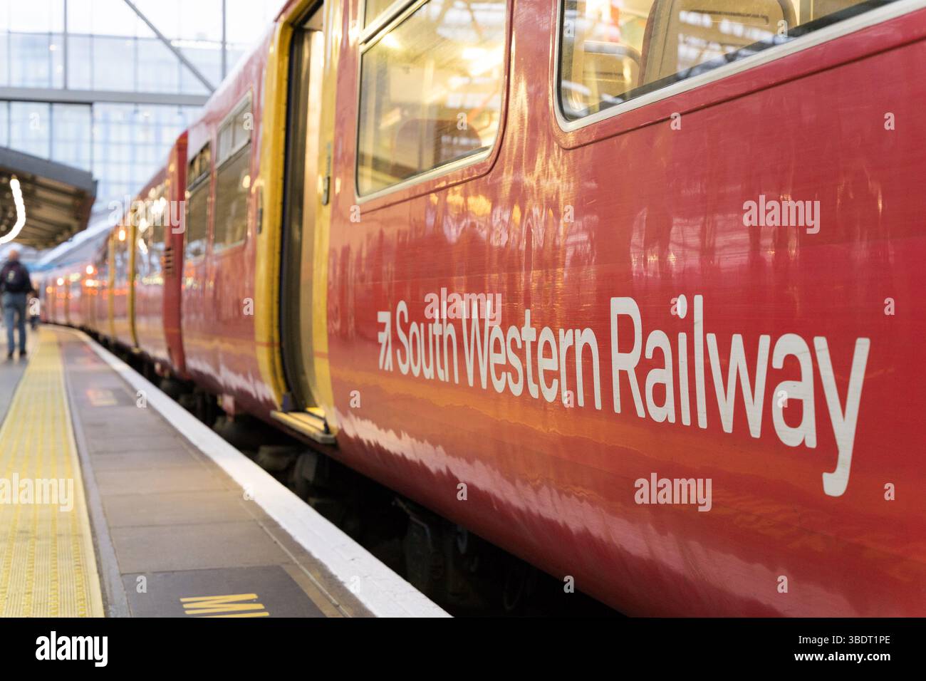 London Waterloo Terminal, UK – 25th May 2025: Passengers Board and ...