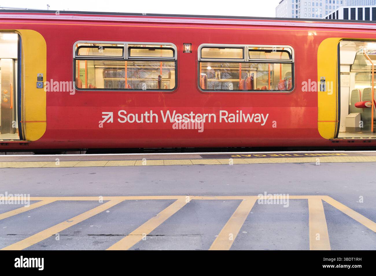 London Waterloo Terminal, UK – 25th May 2025: Passengers Board and ...