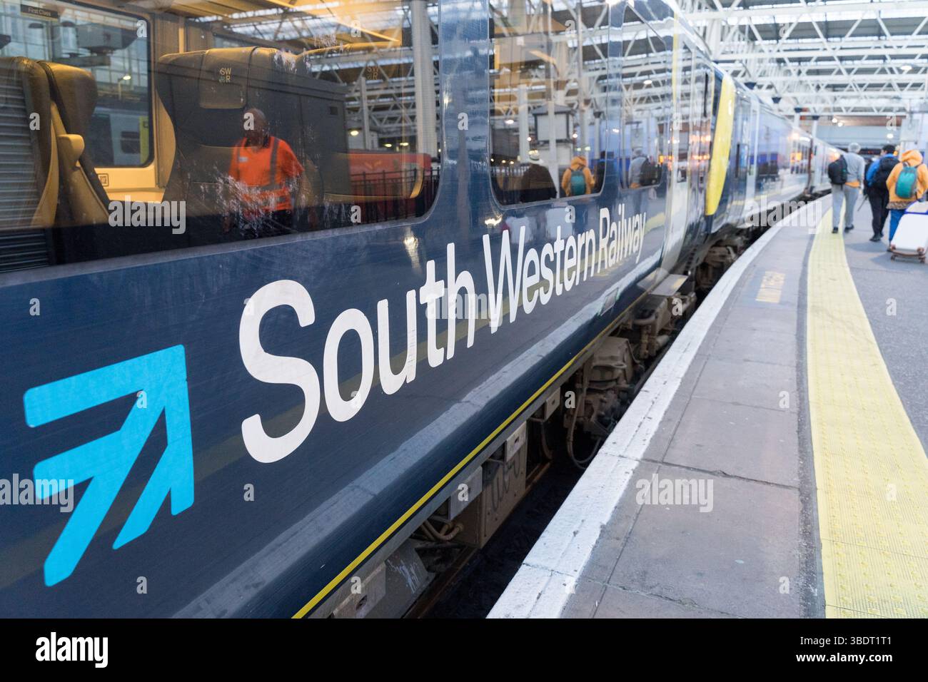London Waterloo Terminal, UK – 25th May 2025: Passengers Board and ...