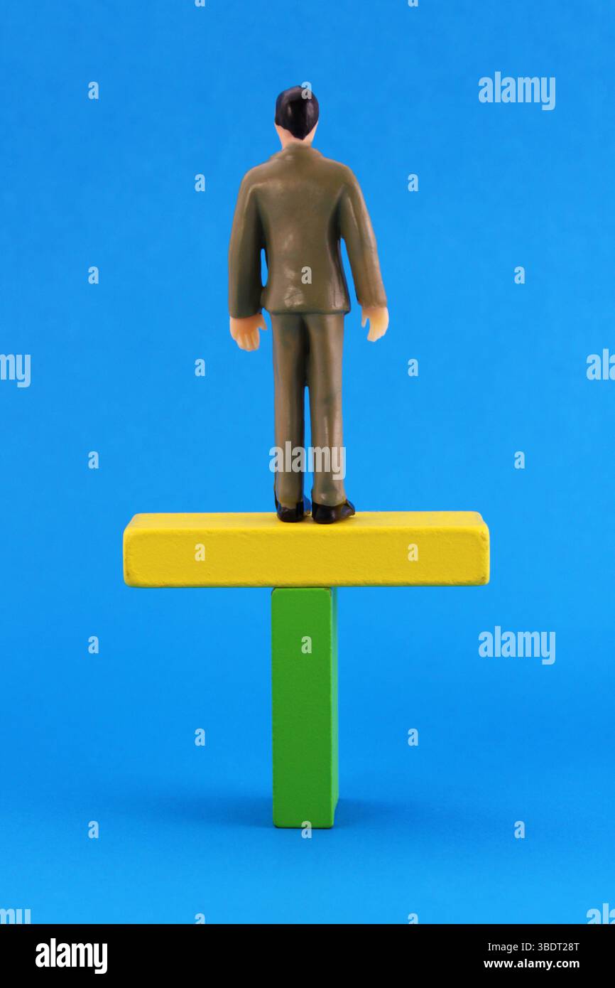 Business executive on colorful balanced structure Stock Photo - Alamy