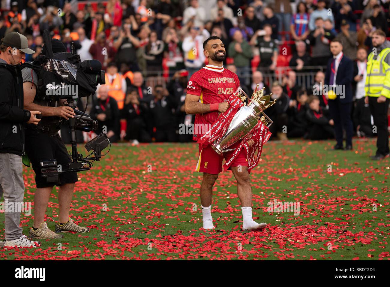 Liverpool's Mohamed Salah with the Premier League Trophy as they ...