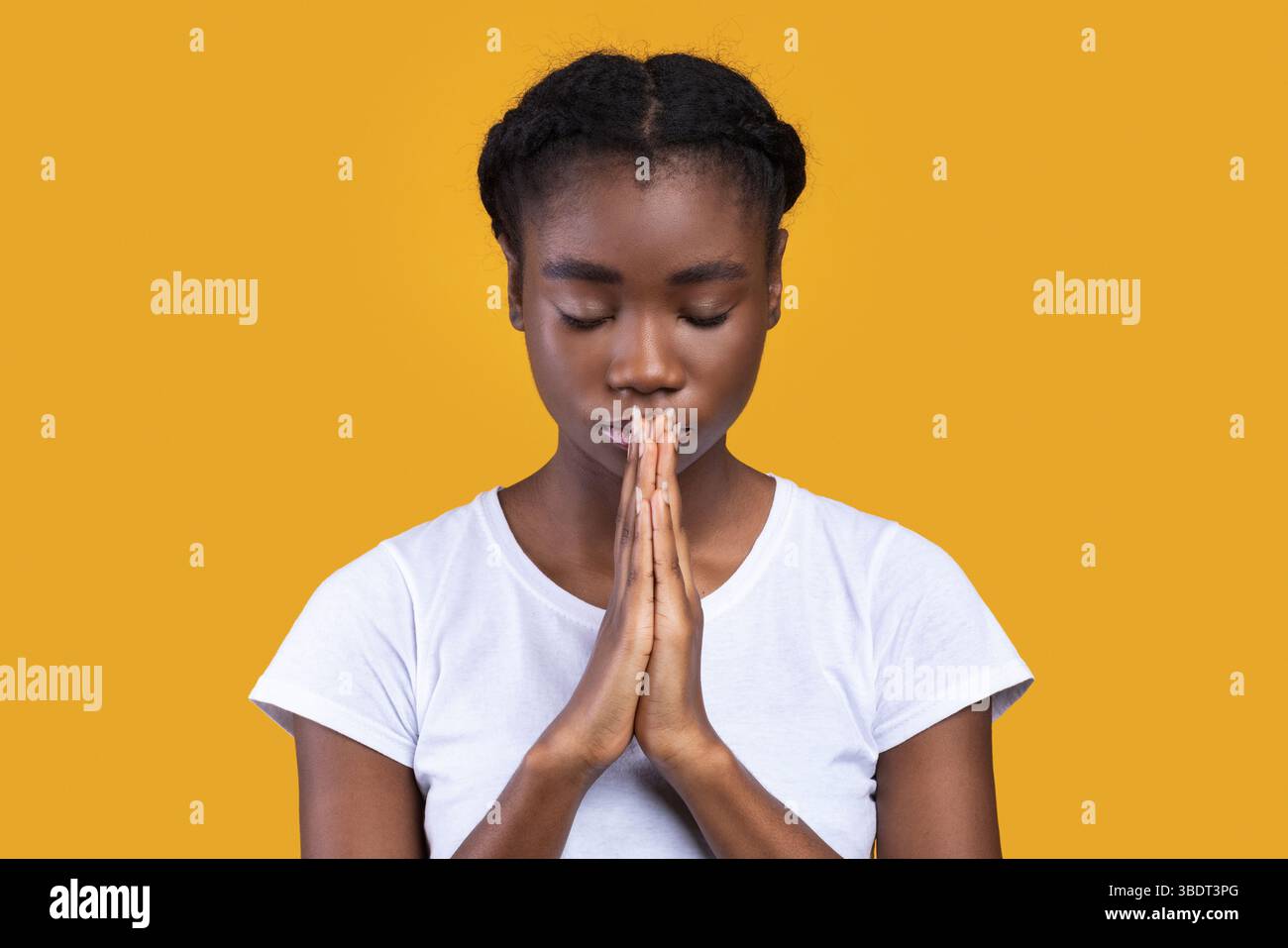 Peaceful African Lady Praying Standing With Eyes Closed In Studio Stock ...
