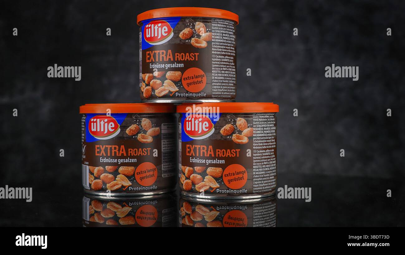 Three cans of Ultje extra roast peanuts stacked and reflecting on a ...