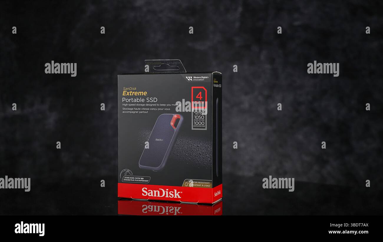 SanDisk Extreme Portable SSD 4TB retail box on a dark background ...