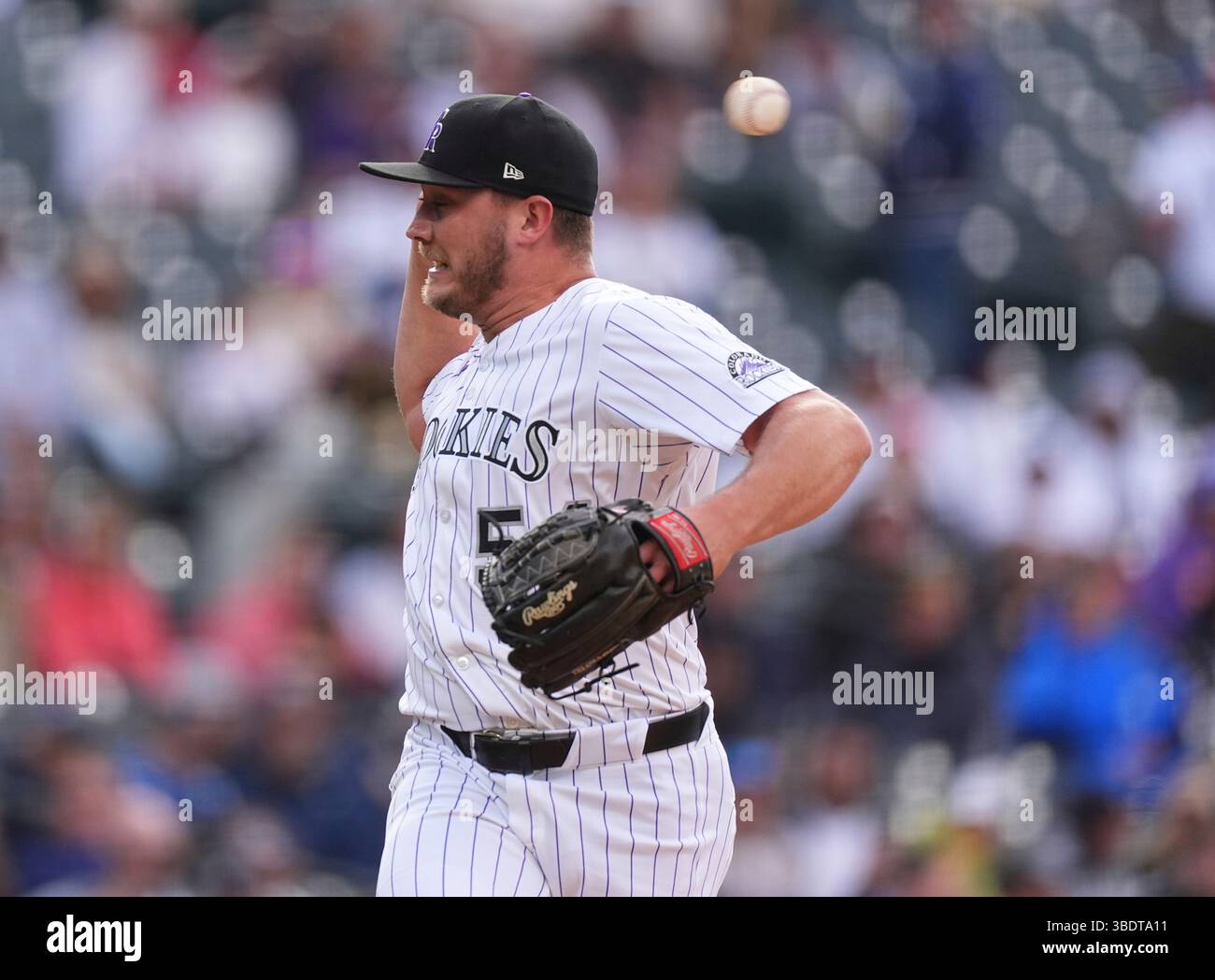 Colorado Rockies relief pitcher Seth Halvorsen avoids a ball hit by New ...