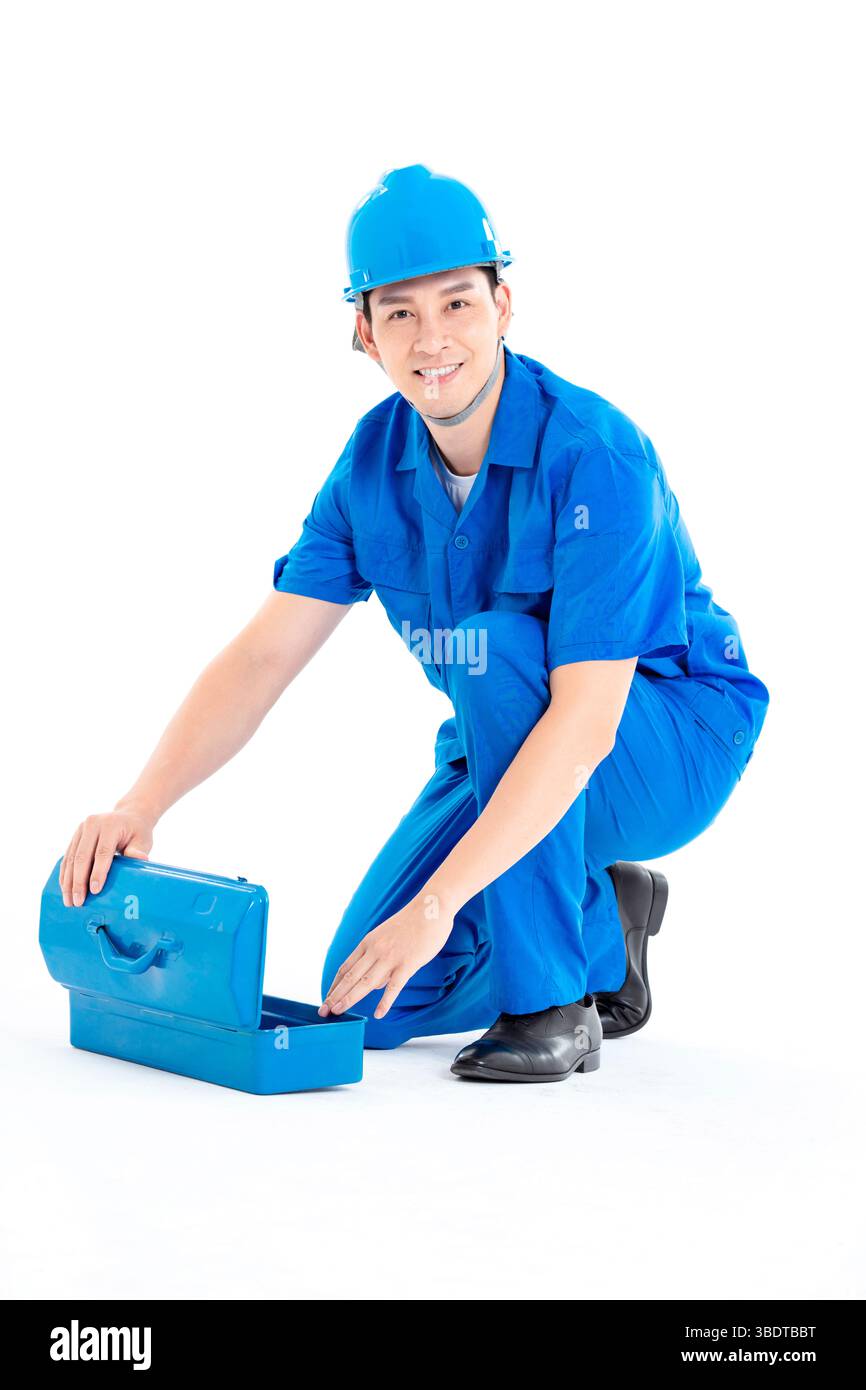 After-sales service personnel in blue workwear Stock Photo - Alamy