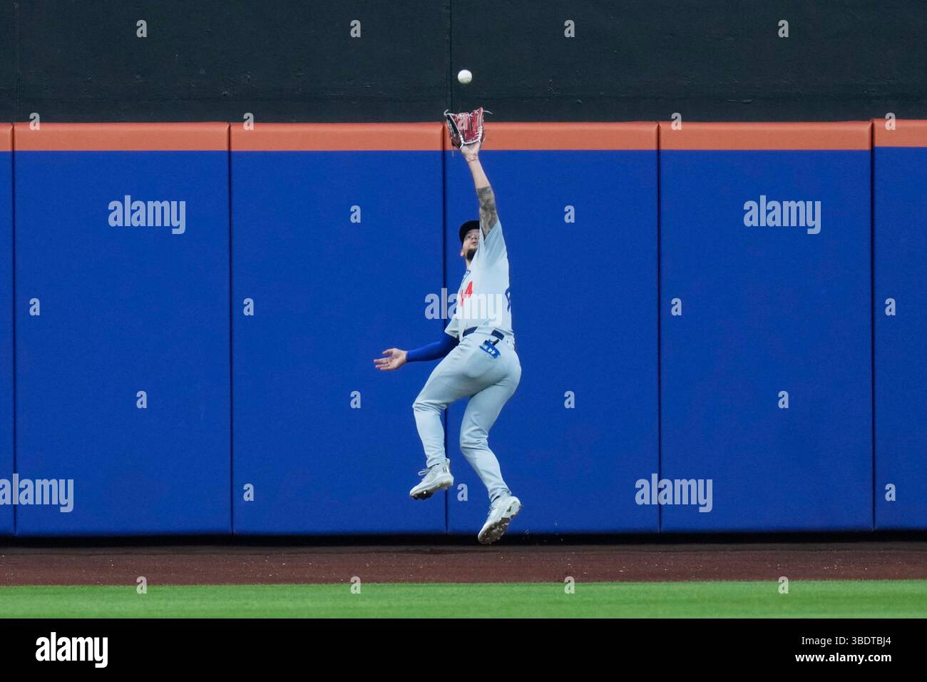 Los Angeles Dodgers outfielder Andy Pages catches a ball hit by New ...