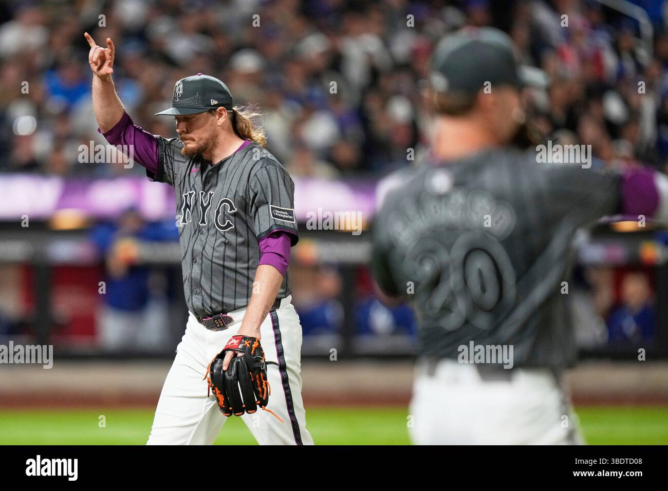 New York Mets pitcher Ryne Stanek, left, reacts after a double play ...