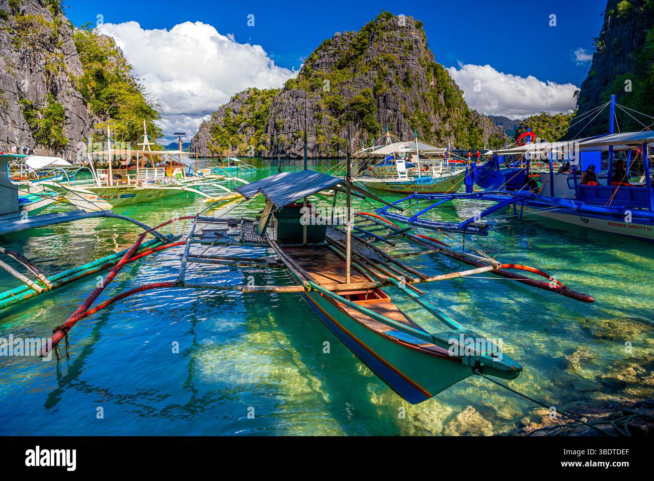 Coron, Palawan, Philippines - JANUARY 10, 2024: Outrigger boats ferry ...