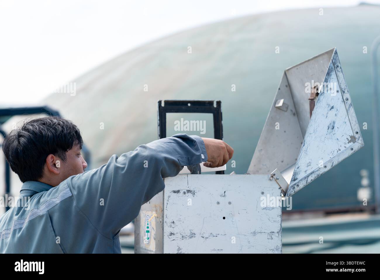 Close up environment officer install air sampling filter on device for ...