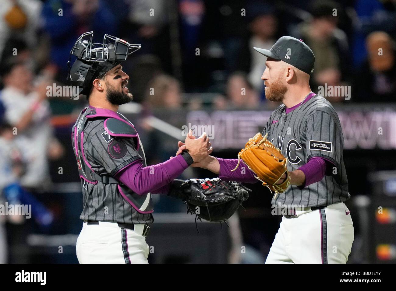 New York Mets pitcher Reed Garrett, right, and catcher Luis Torrens ...
