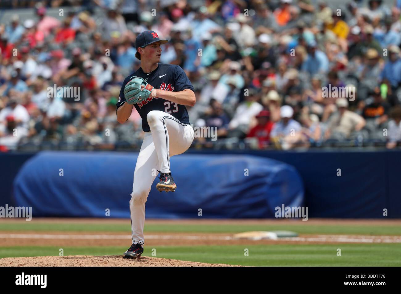 HOOVER, AL - MAY 25: Ole Miss pitcher Hudson Calhoun (23) kicks his ...