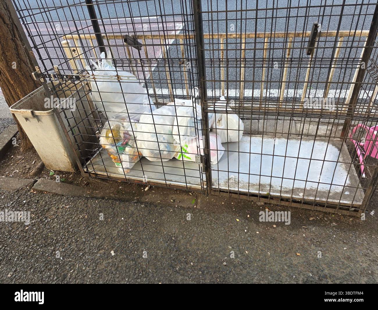 Japanese Trash in Steel Cage Stock Photo - Alamy