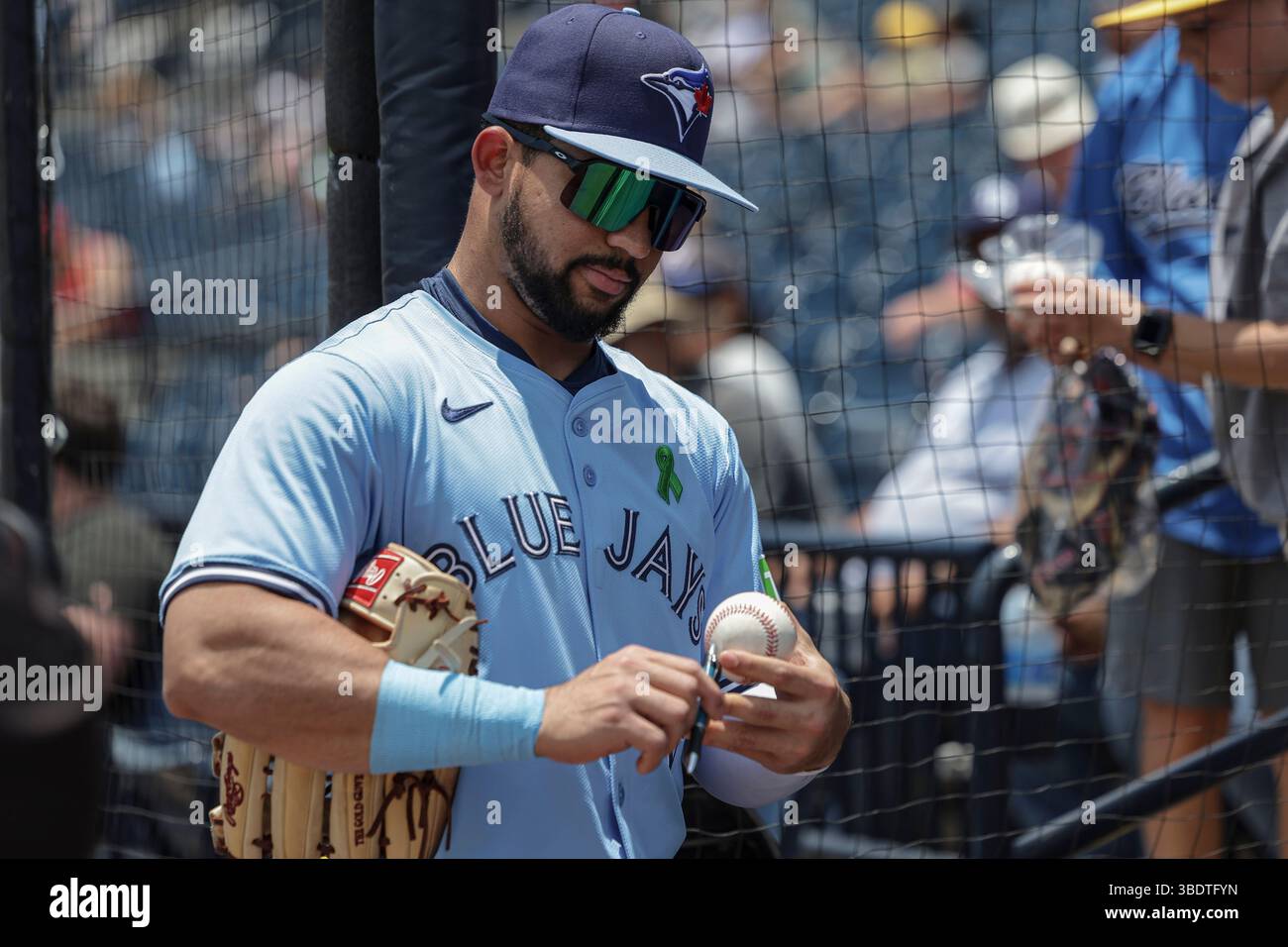 Tampa, FL USA: Toronto Blue Jays left fielder Jonatan Clase (8) signs a ...