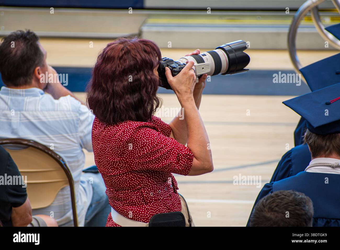 American Fork, UT, USA – May 24, 2025: A photojournalist documents a ...
