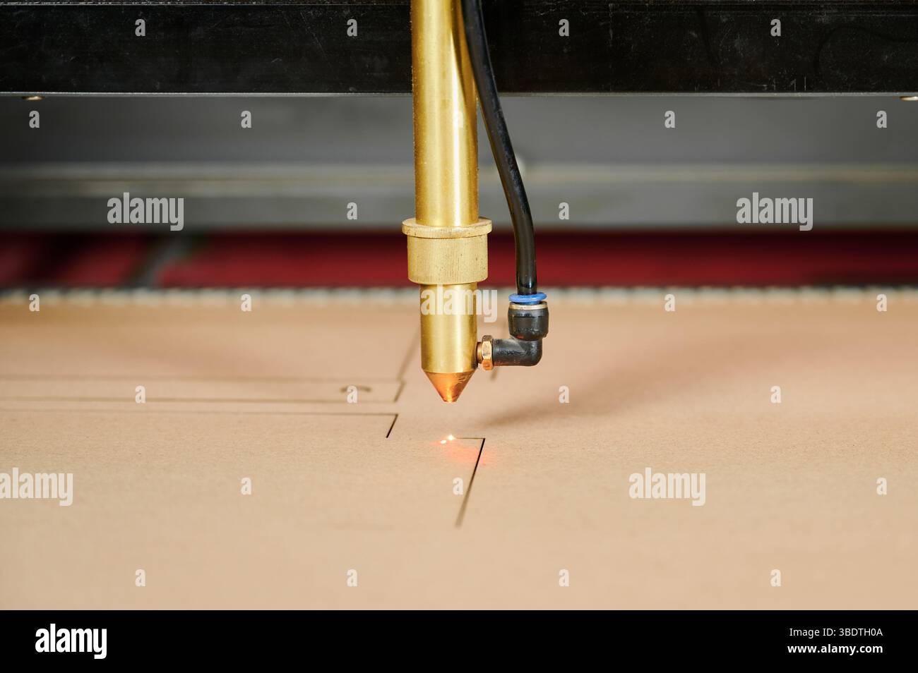 Innovative laser cutting technology shapes cardboard sheets in a ...