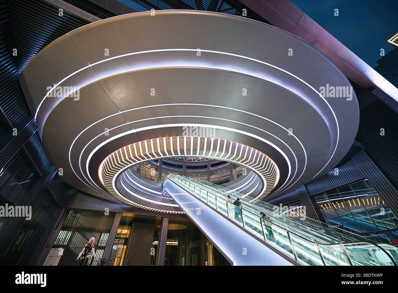 Visitors ride escalators designed to resemble the entryway to a ...