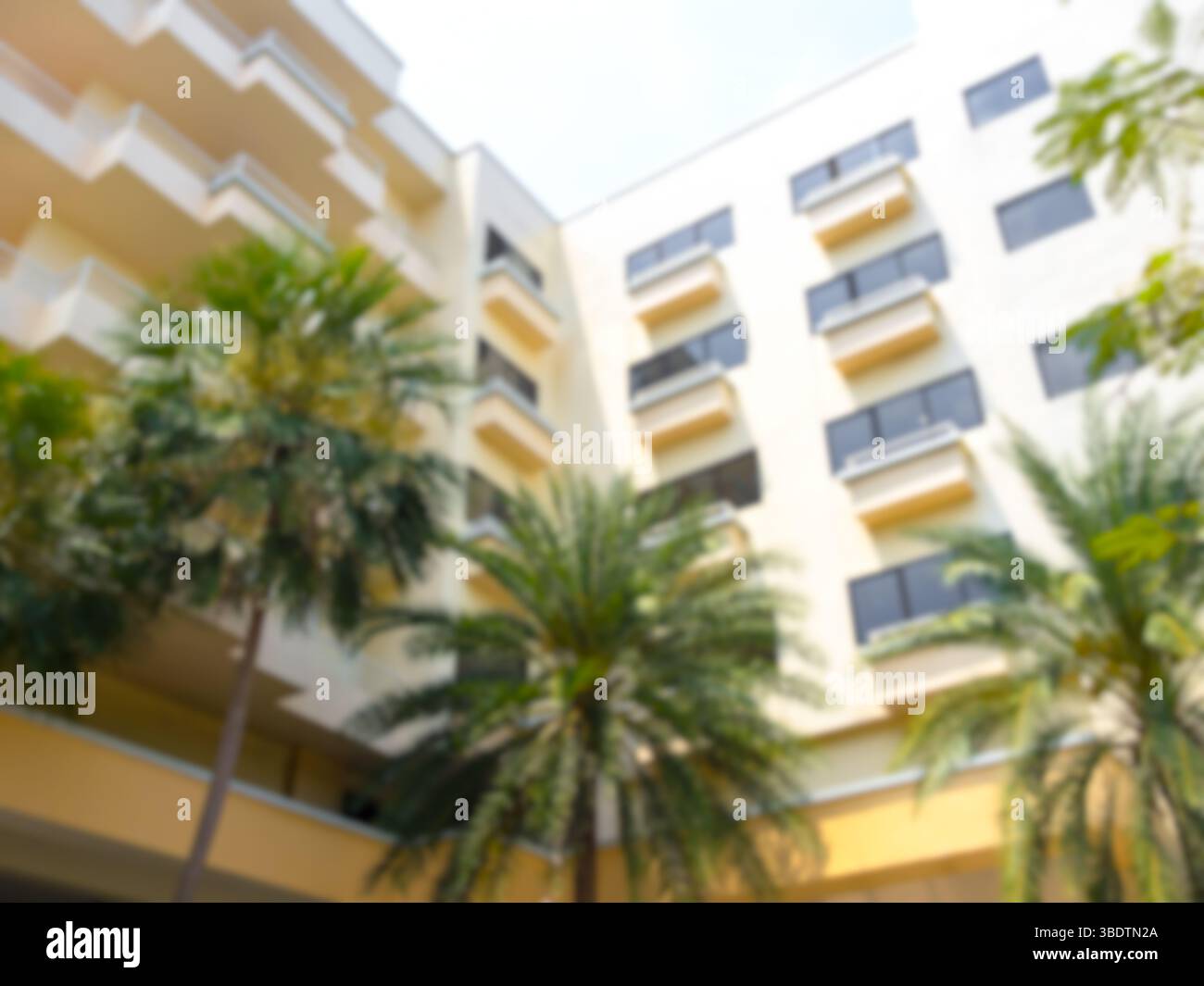 Abstract blurred contemporary style of yellow hotel building with ...