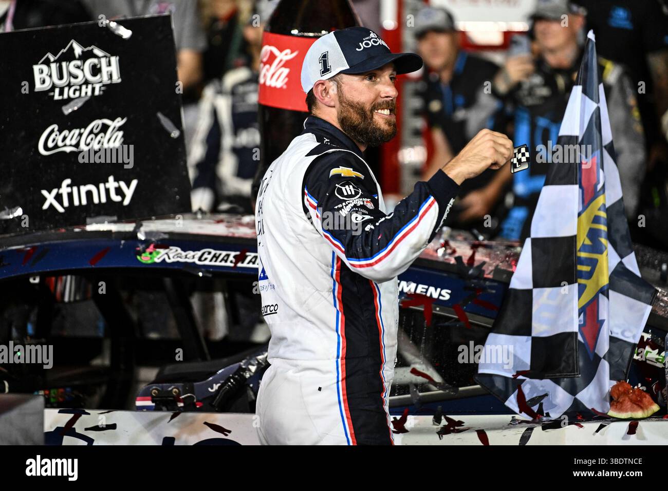 Ross Chastain celebrates in Victory Lane after winning a NASCAR Cup ...