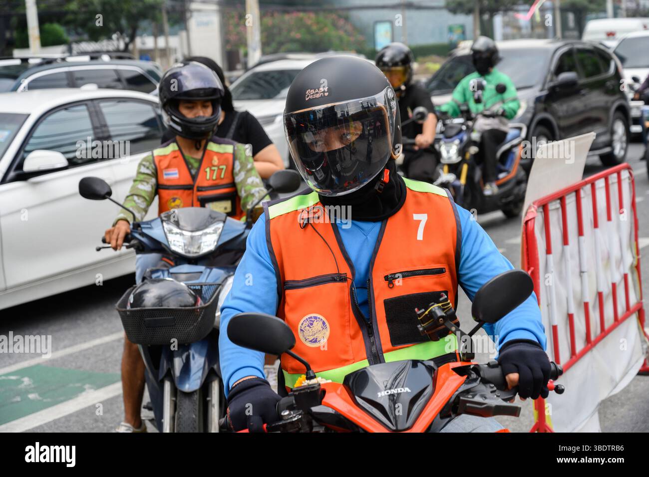 Bangkok, Thailand. 21st Feb, 2025. Thai motorcycle delivery riders seen ...