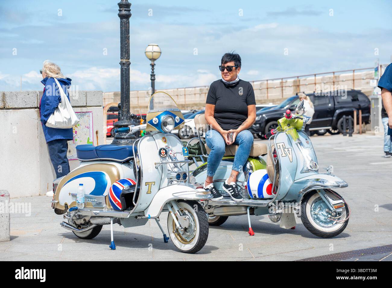 Margate, UK. 25th May, 2025. A mod lady sits on the scooter during the ...