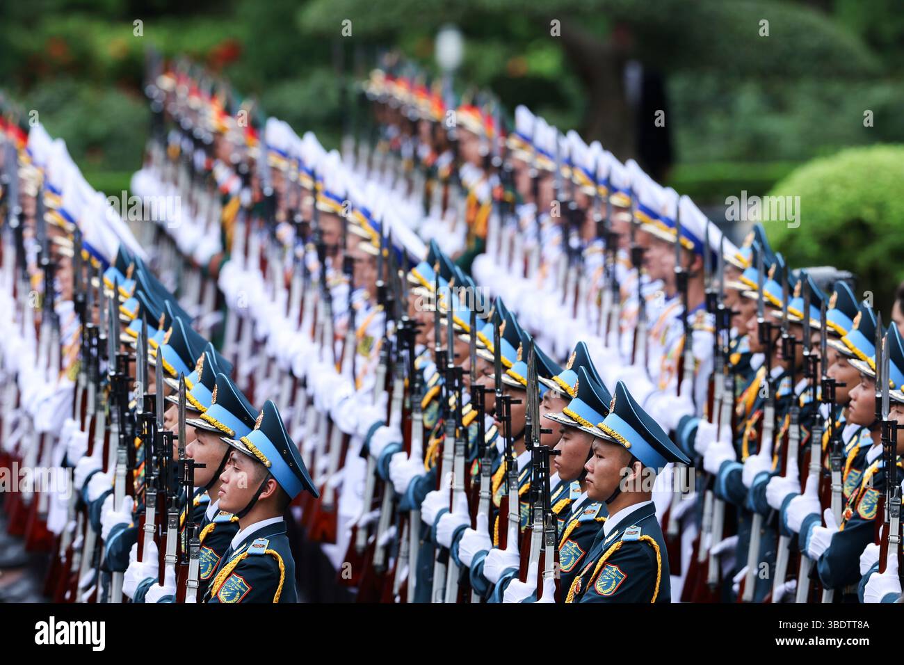 Members of an honor guard stand in formation during a welcome ceremony ...
