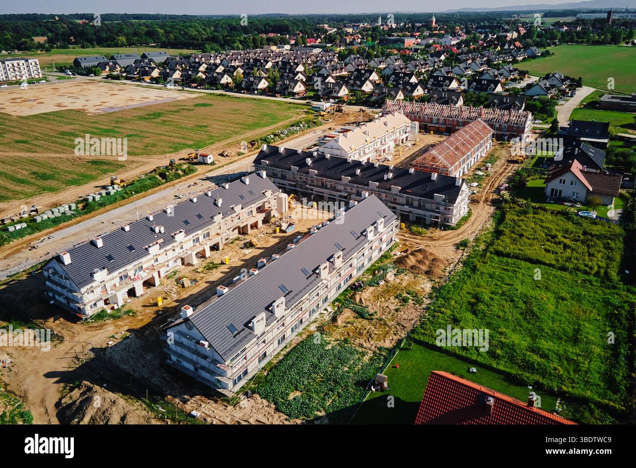 Aerial view of large housing estate under construction with modern ...